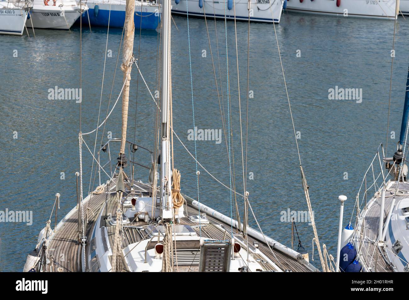Sailboats side by side in the harbor Stock Photo - Alamy