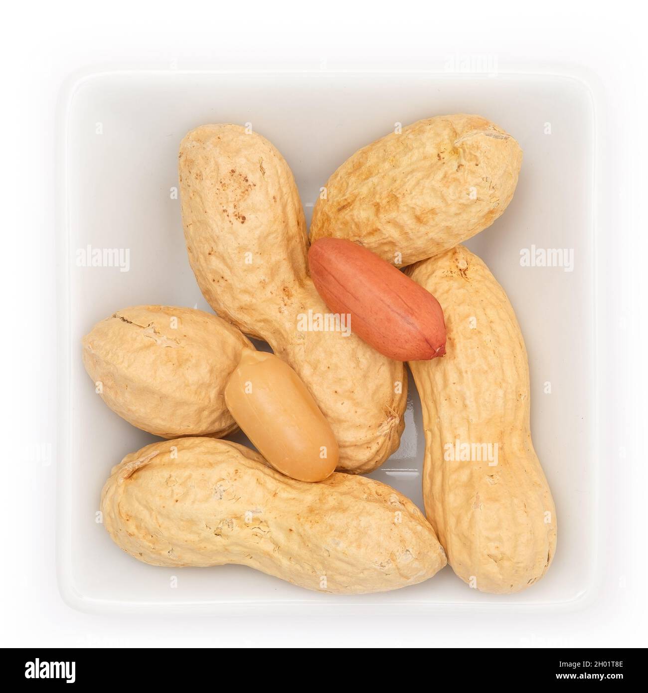 A top view of a plate of peanuts with shells Stock Photo - Alamy