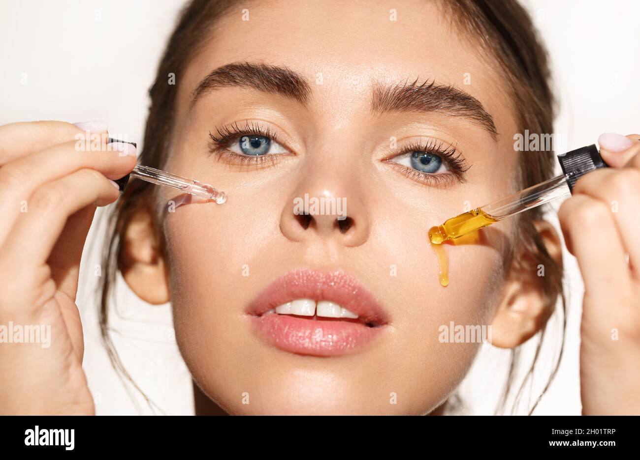 Using body serum hi-res stock photography and images - Alamy