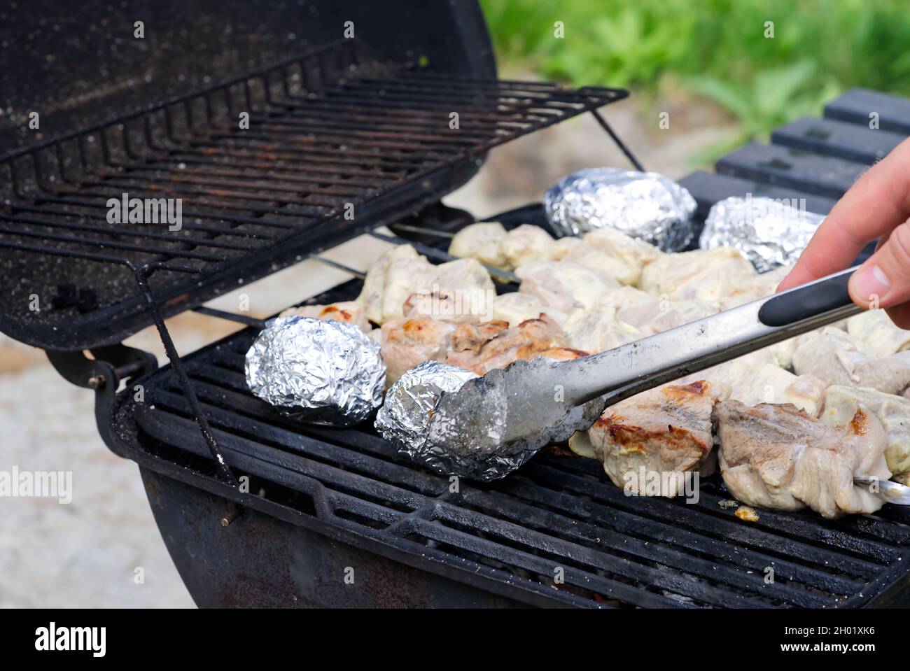 Grilled Barbeque meat. Tasty pork meat on skewers. food for picnic ...