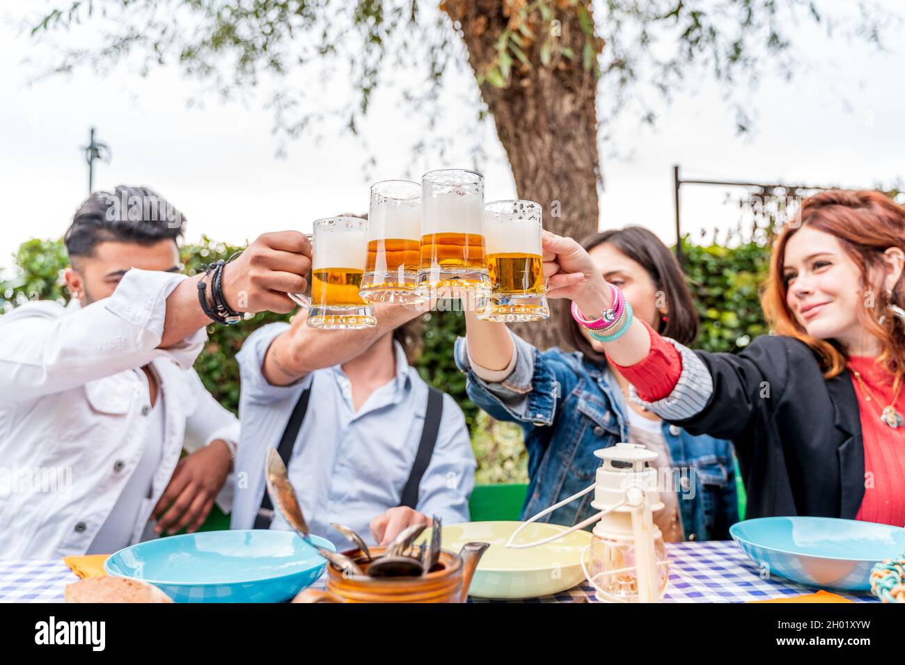 group of friends having fun at garden home party - Young people smiling ...