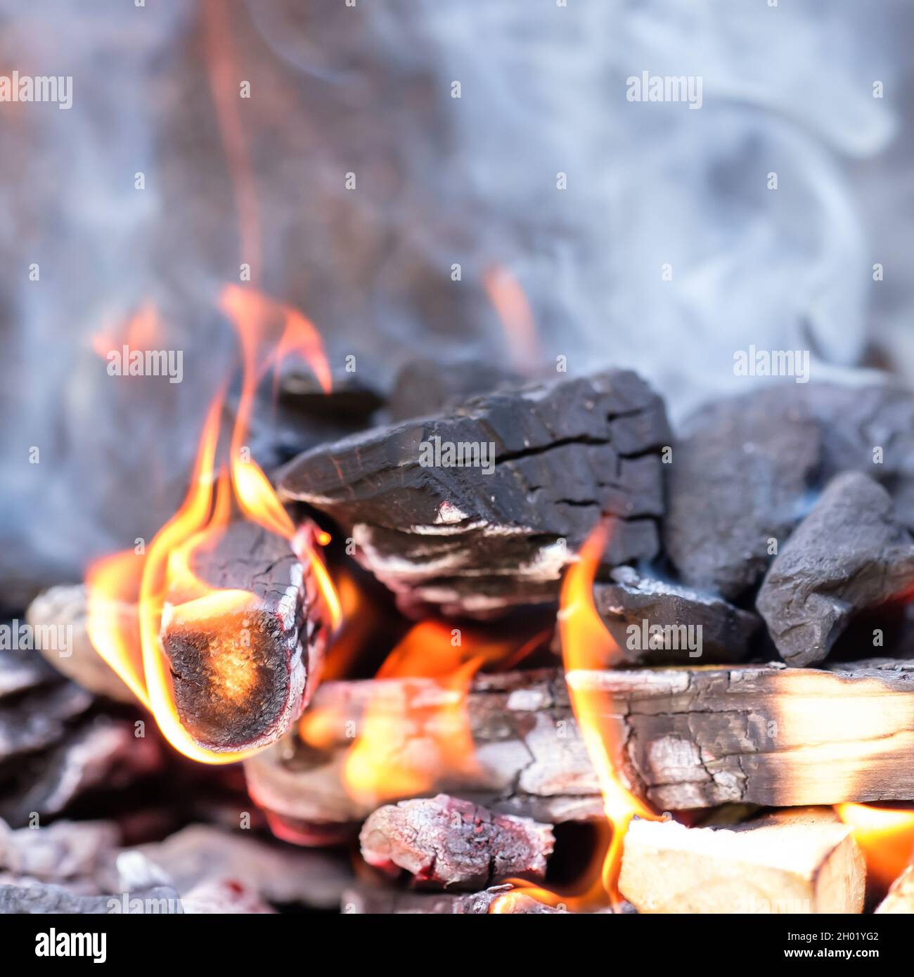 A fire flame charcoal with smoke Stock Photo - Alamy