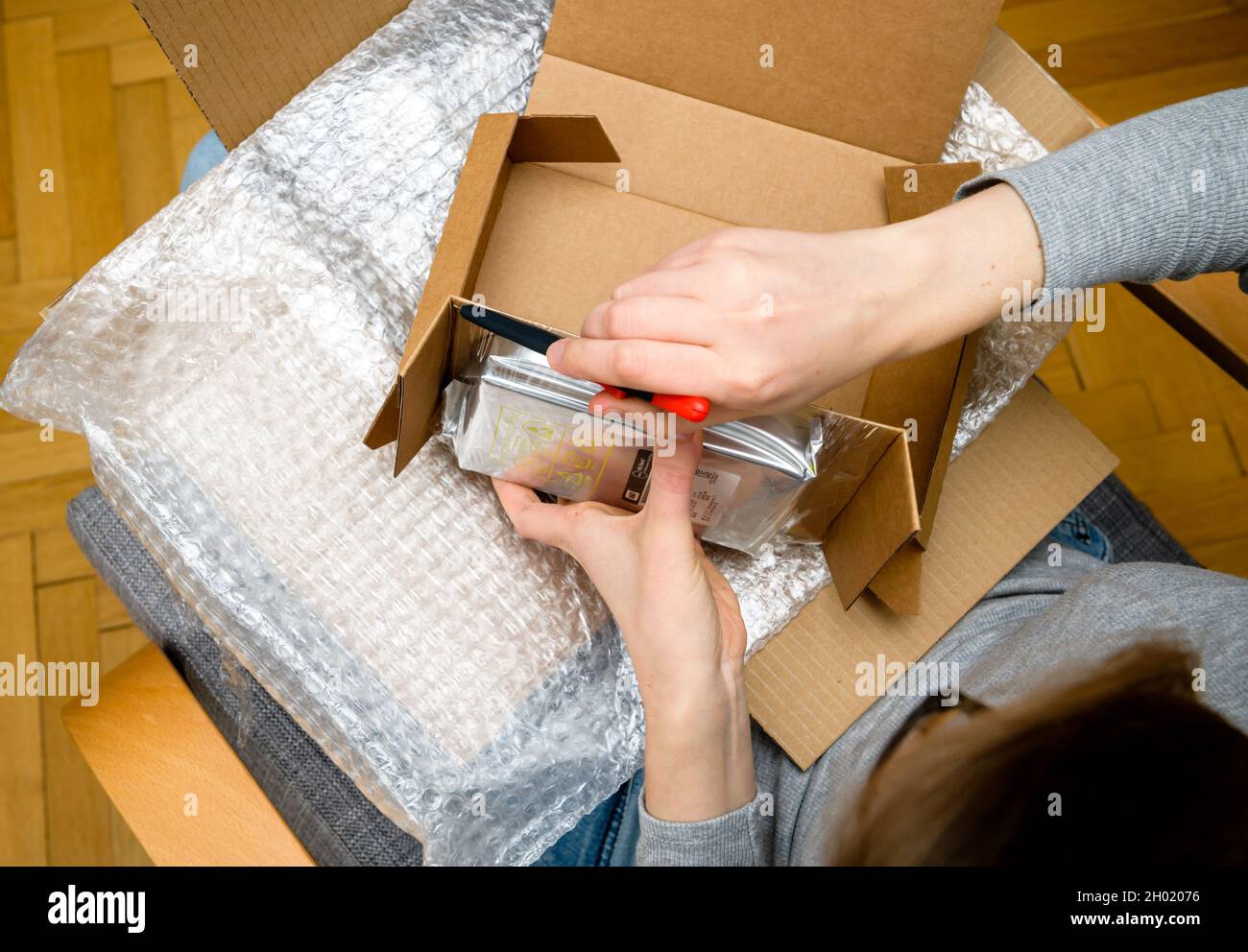 View from above of woman hand unboxing unpacking Western Digital HDD ...
