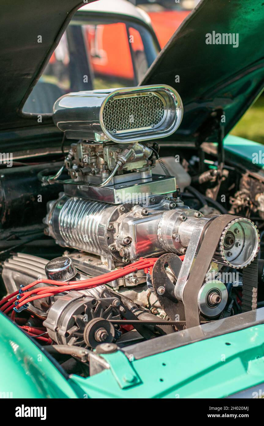 Supercharged v8 engine of a classic car with a bonnet open Stock Photo ...