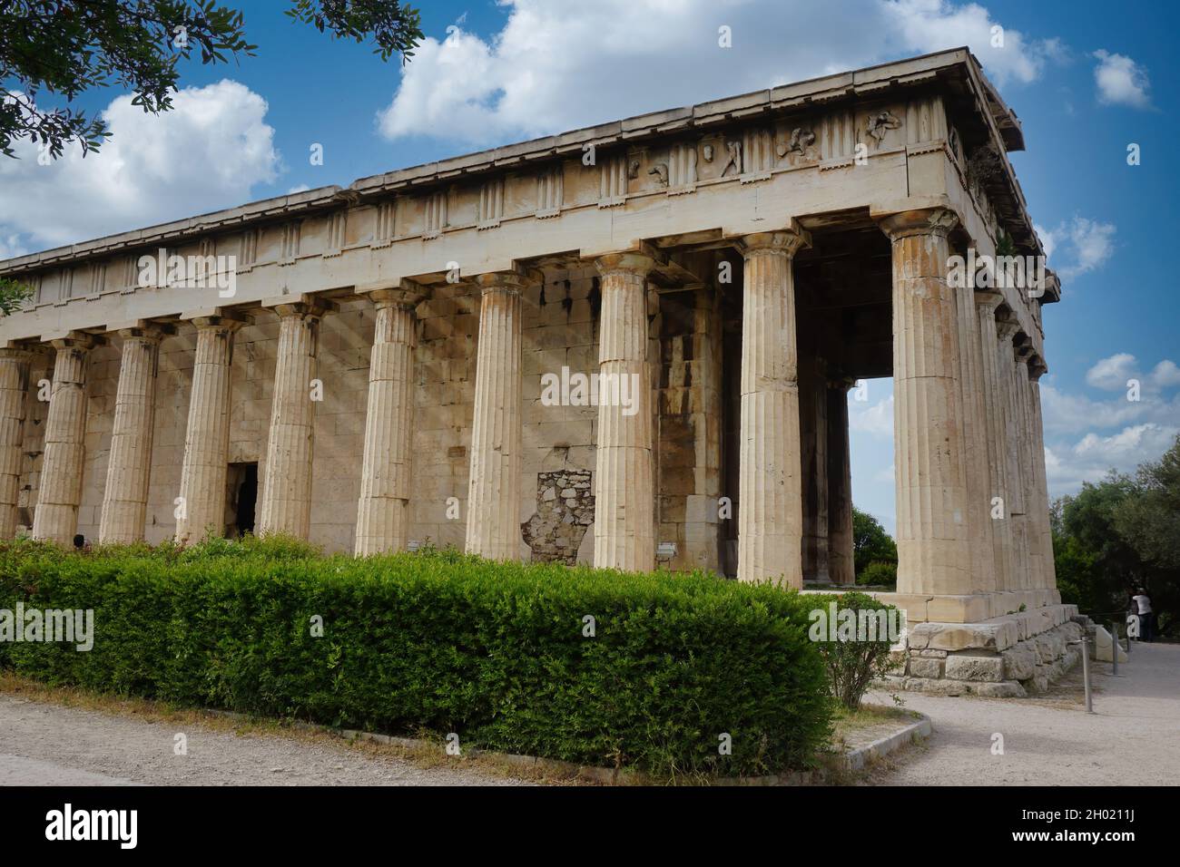Afternoon light filters through the columns of the ancient Greek temple ...