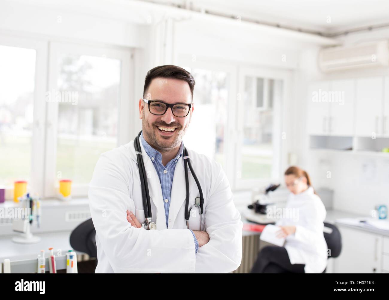 Doctor standing in chemist hi-res stock photography and images - Alamy