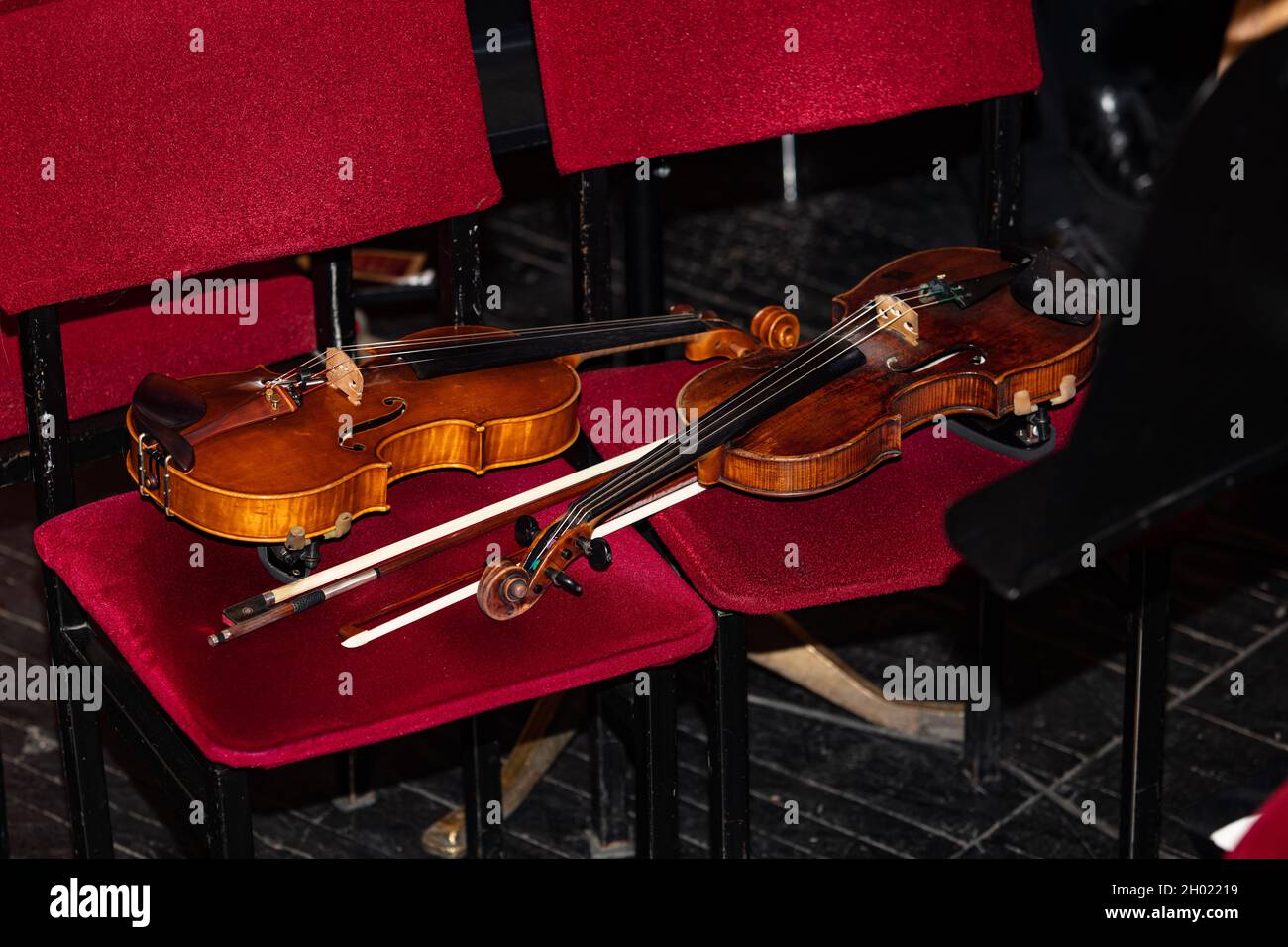 violns on chairs during interval in theatre Stock Photo - Alamy