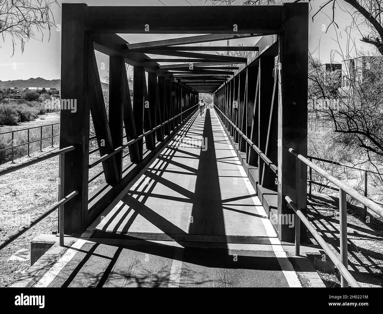 High contrast black and white shot of biker on iron bridge, Rillito ...