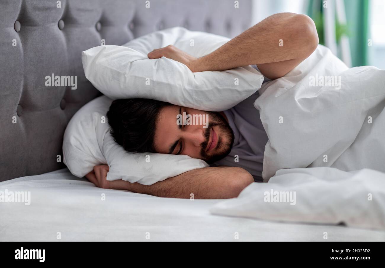 Casual man feeling uncomfortable sleeping hi-res stock photography and ...