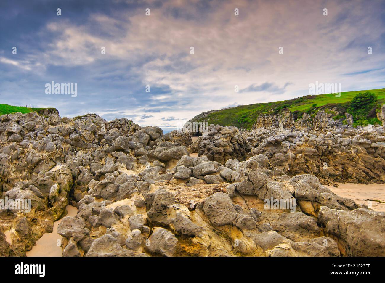 Rocky stones surrounded with grass-covered rocks from both sides ...