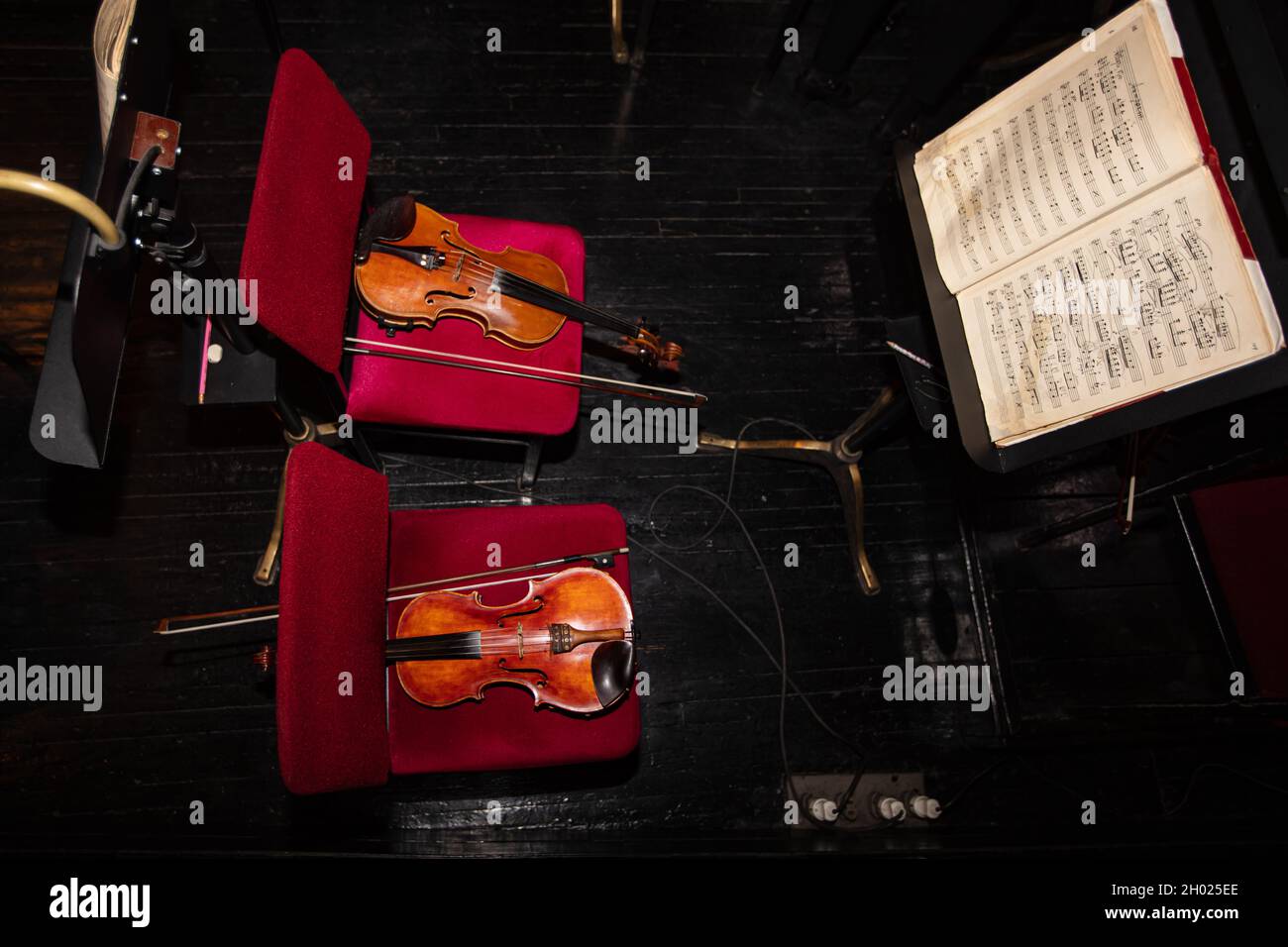 violns on chairs during interval in theatre Stock Photo - Alamy