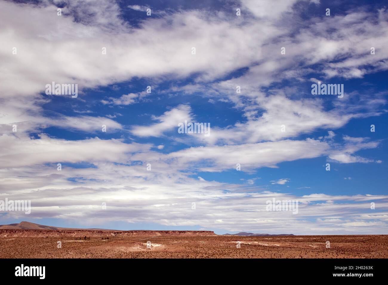 Blue desert sky with clouds hi-res stock photography and images - Alamy
