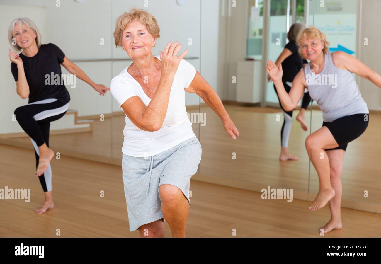 Mature women practice active dancing in the studio Stock Photo - Alamy
