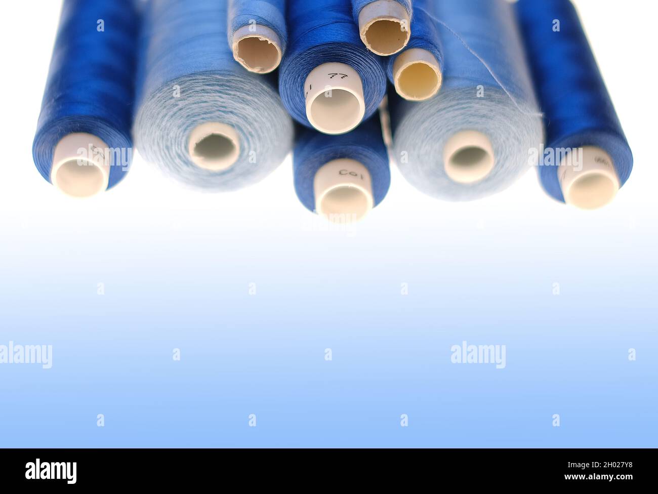 Sewing threads set.Blue and gray thread spools. Thread collage ...