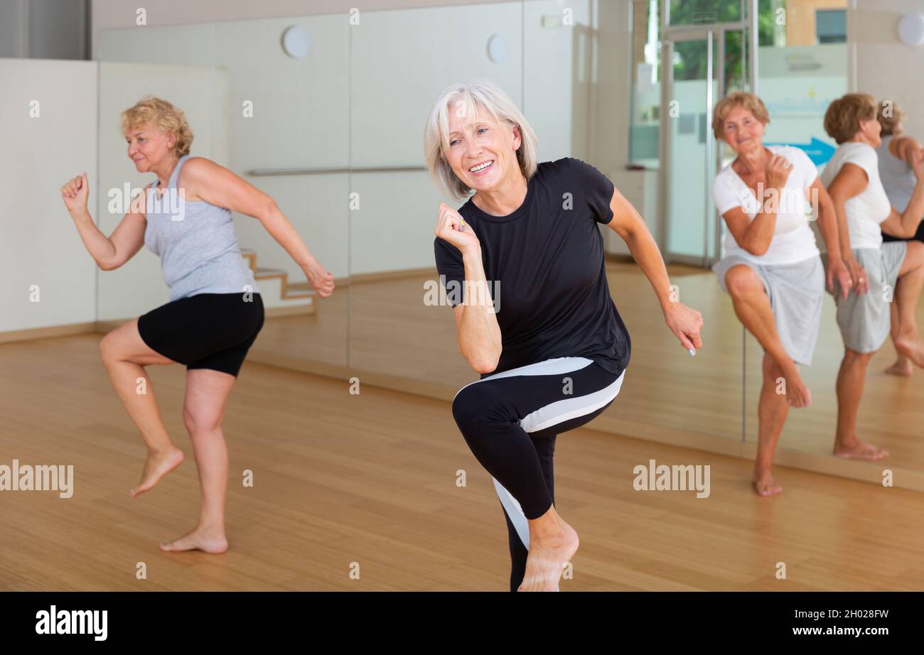Mature women practice active dancing in the studio Stock Photo - Alamy