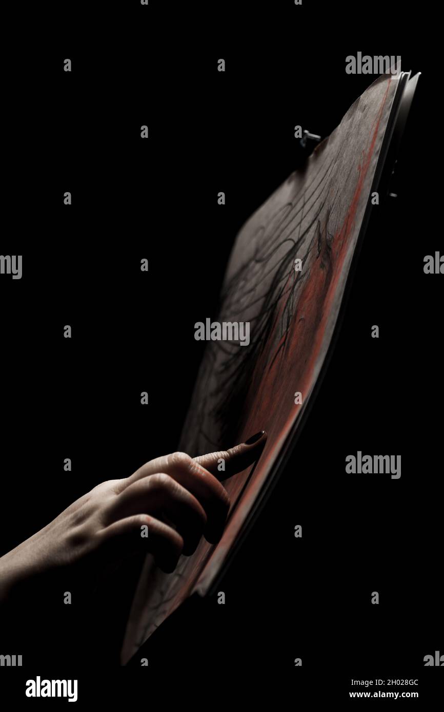 Artist drawing with fingers. Abstract hand painting on paper against ...