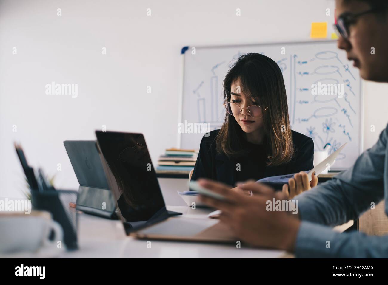 Business team working together and training to analyze technical price ...