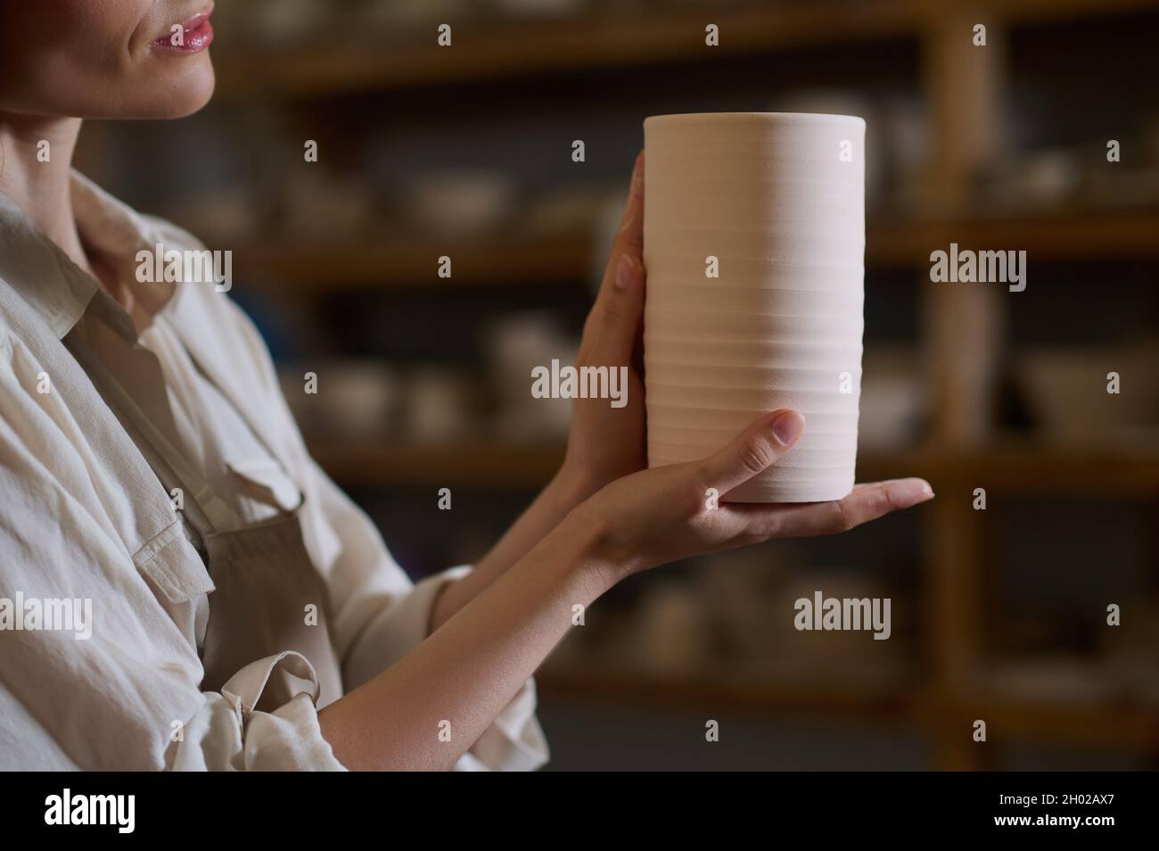 Hands holding clay pot hi-res stock photography and images - Alamy
