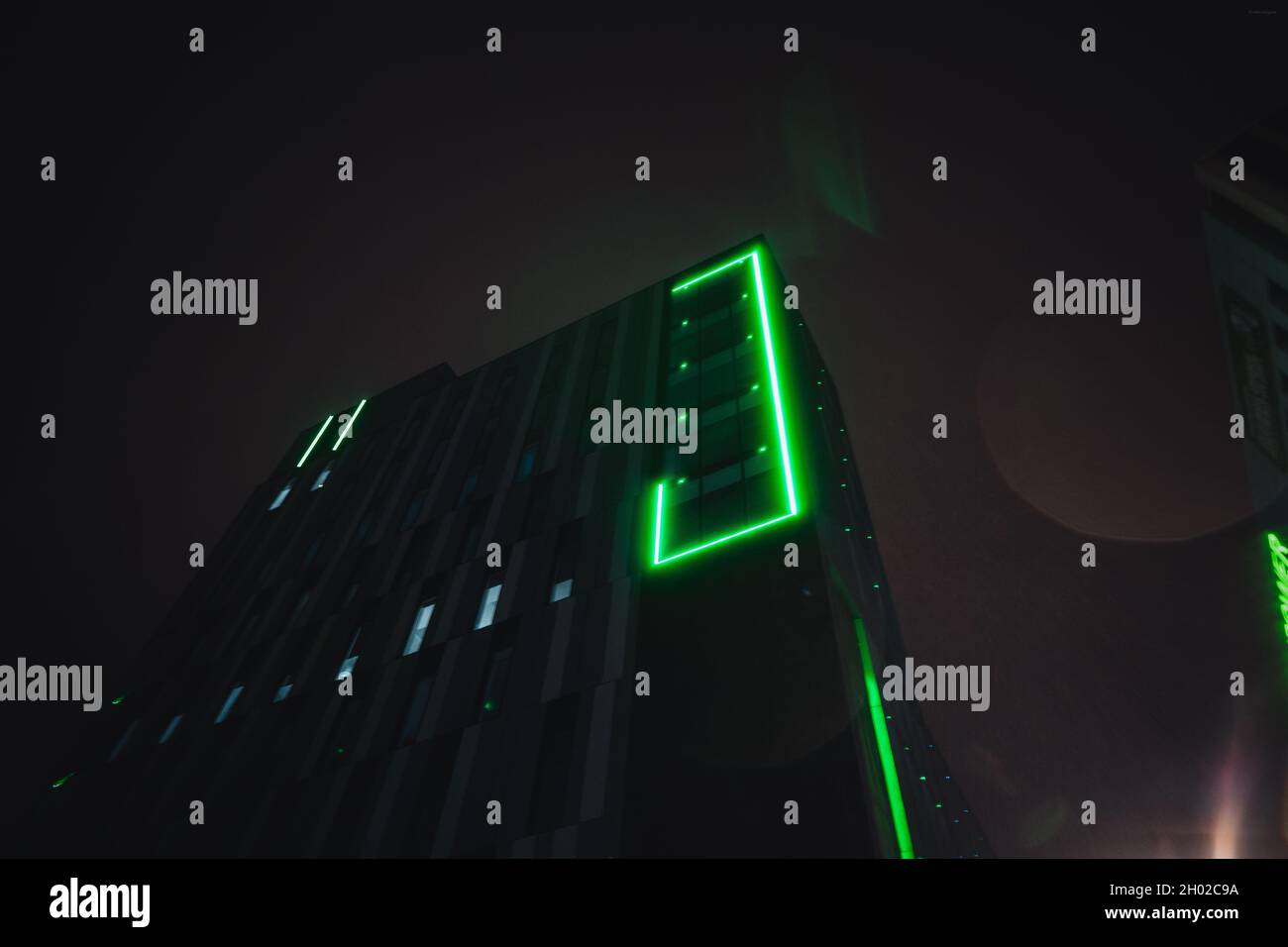 green neon building signage orb Stock Photo - Alamy