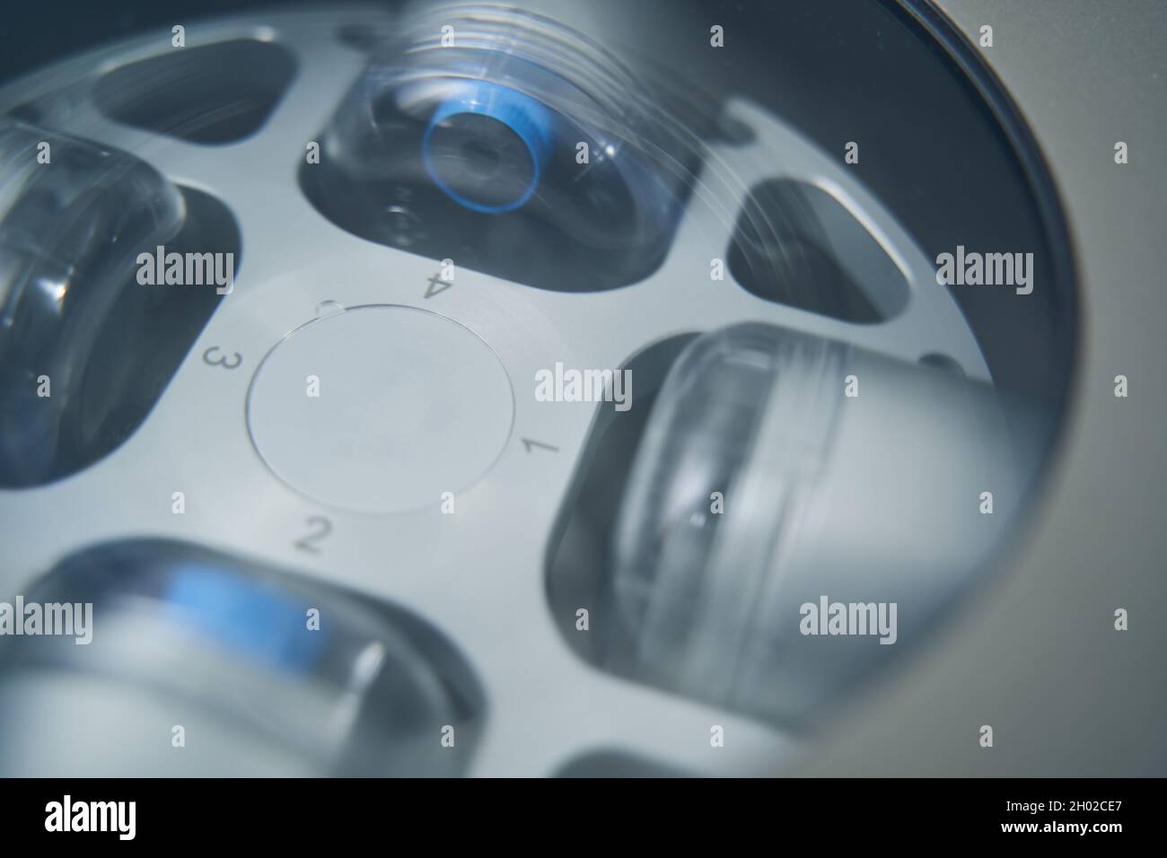 Blood sample containers in lab centrifuge machine Stock Photo - Alamy