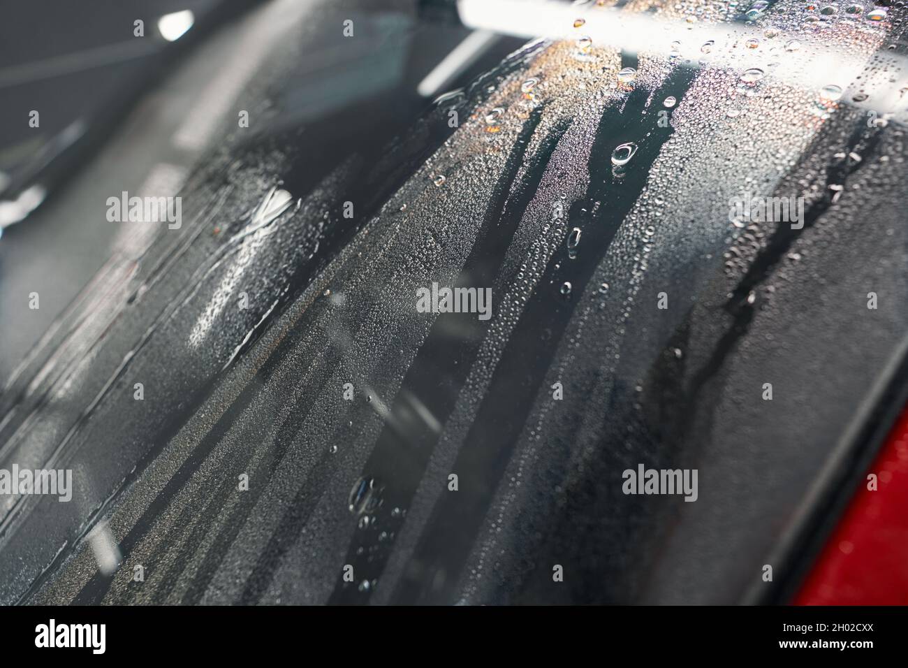 Photo of car hood after cleaning by high pressure washer Stock Photo ...