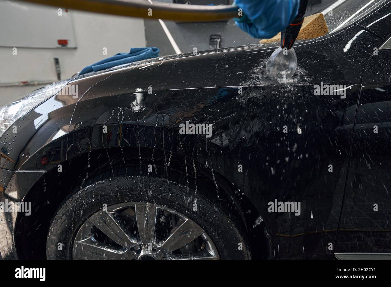 Process of washing modern car by high pressure water indoors Stock ...