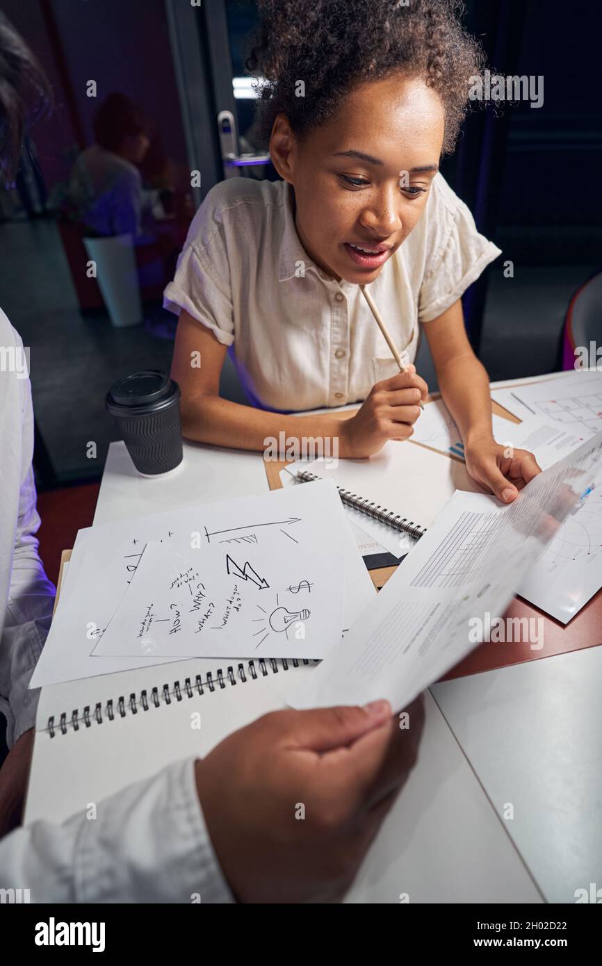 Employees examining data for meeting in cabinet Stock Photo - Alamy