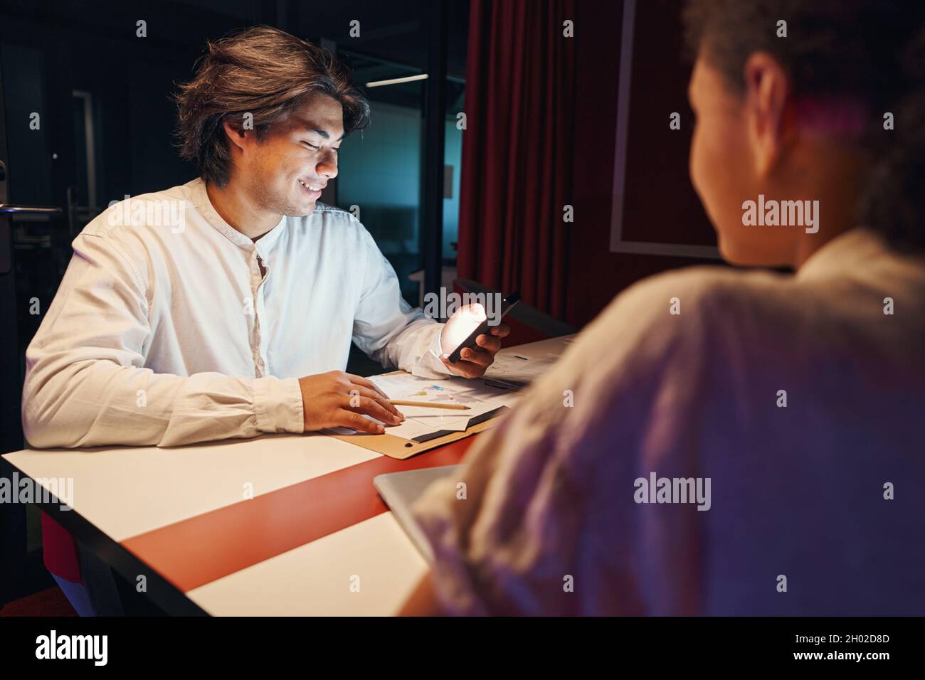 Female person preparing documents for presentation together Stock Photo ...