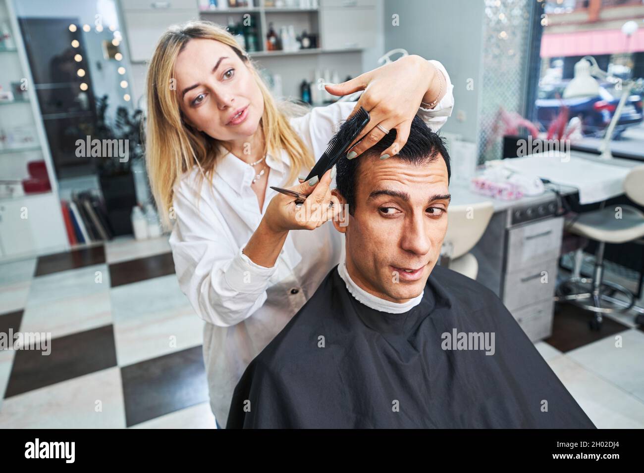 Cutting off hair hi-res stock photography and images - Alamy