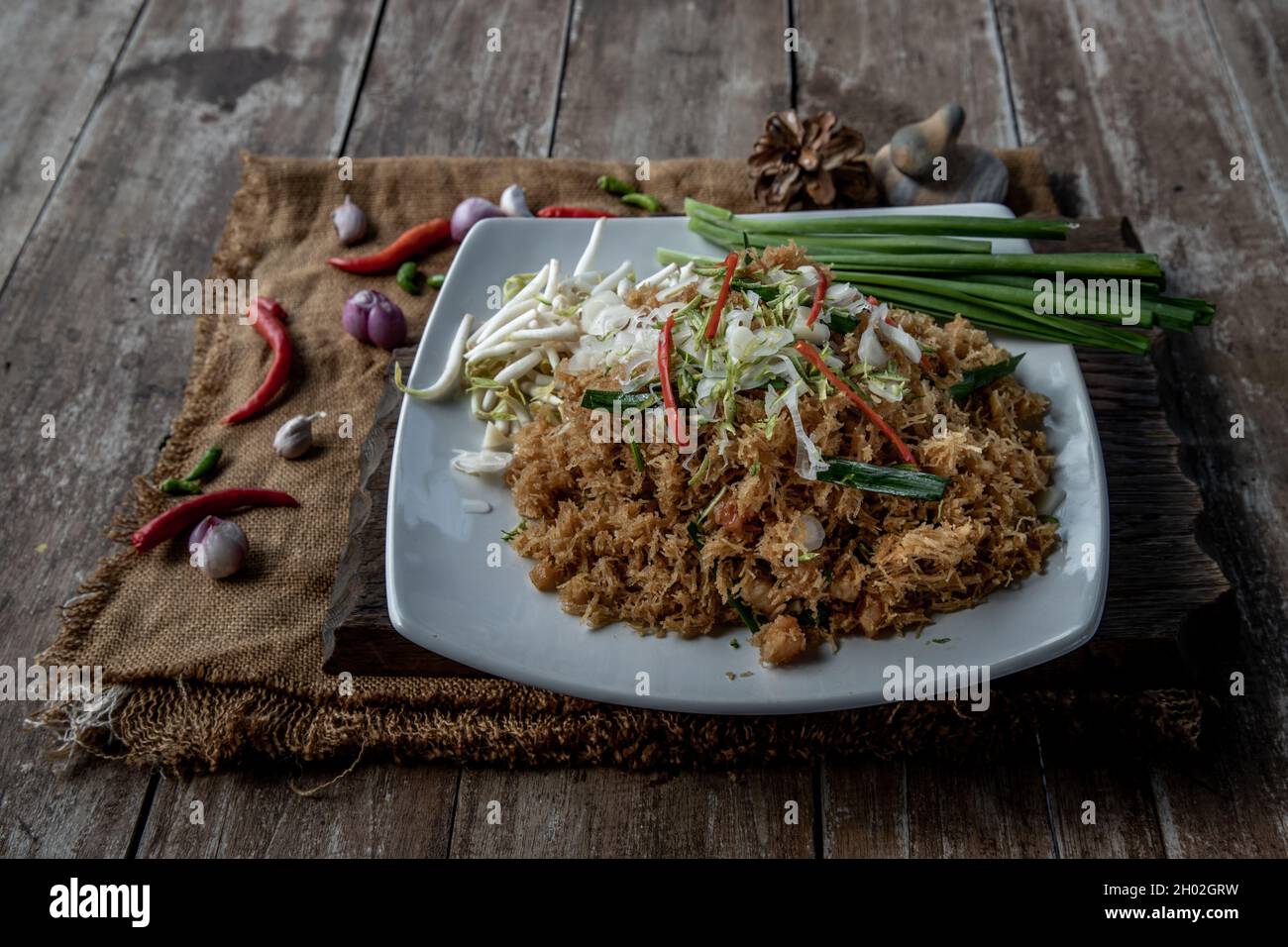 Asian eating food, Mee Grob is an sweet and sour crispy noodles, made ...