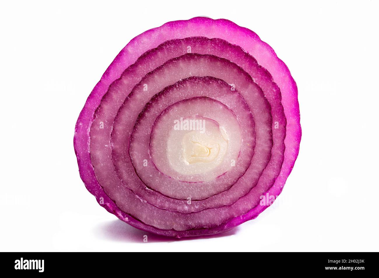 Violet onion in a cut on a white background close-up Stock Photo - Alamy
