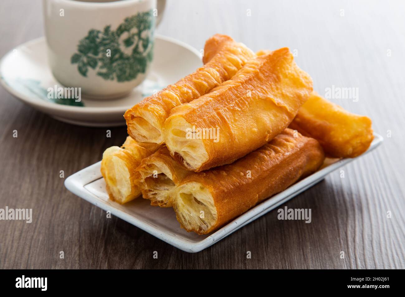 Youtiao (Chinese fried breadstick). Long golden brown deep fried dough ...