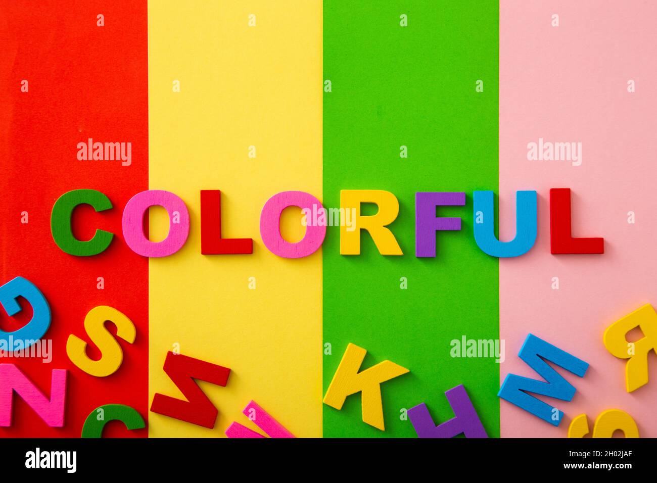 Bright multicolored alphabet with colorful wording background. Flat Lay ...