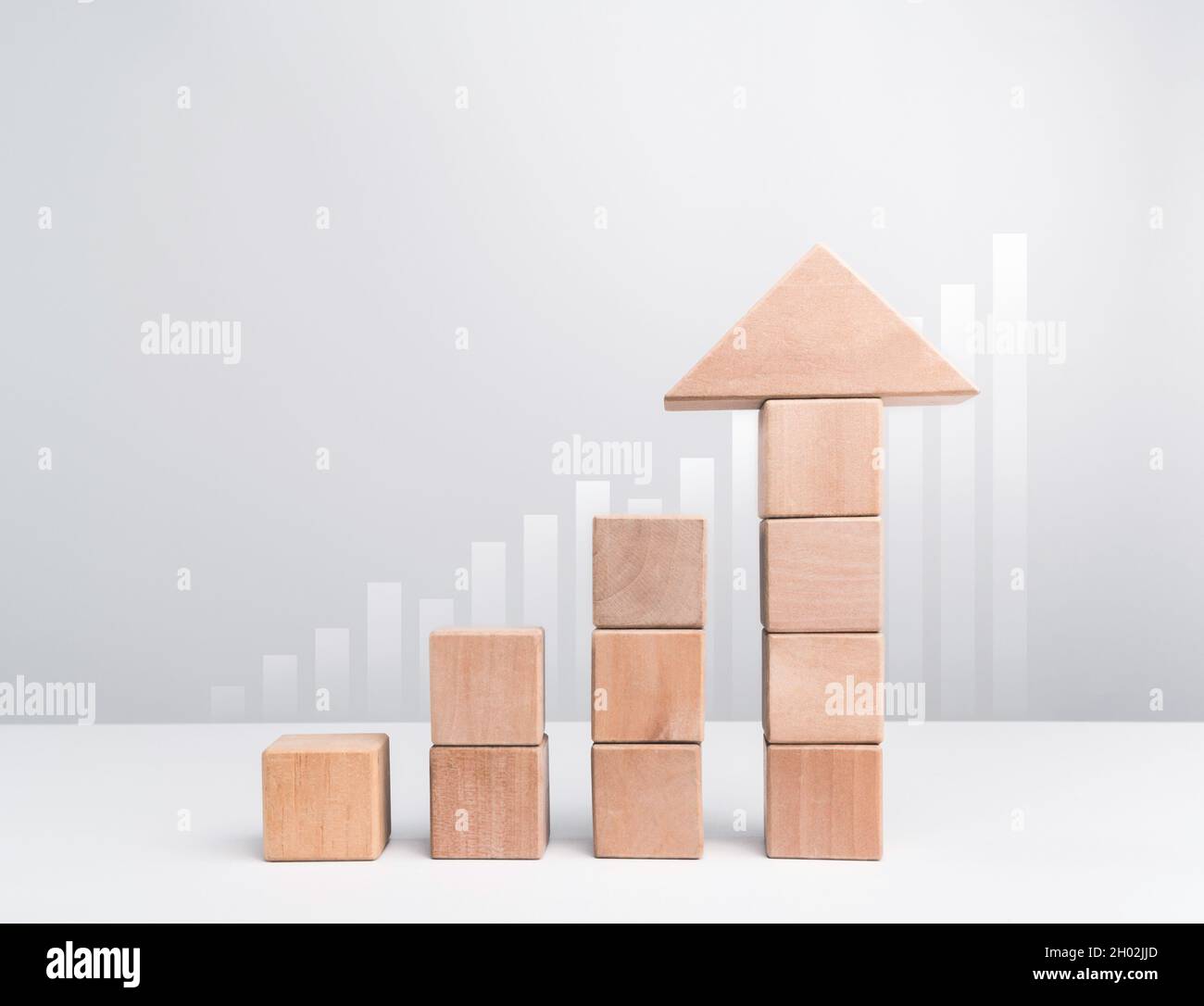 Business growth success concept. Wooden blocks stacking as an arrow up ...