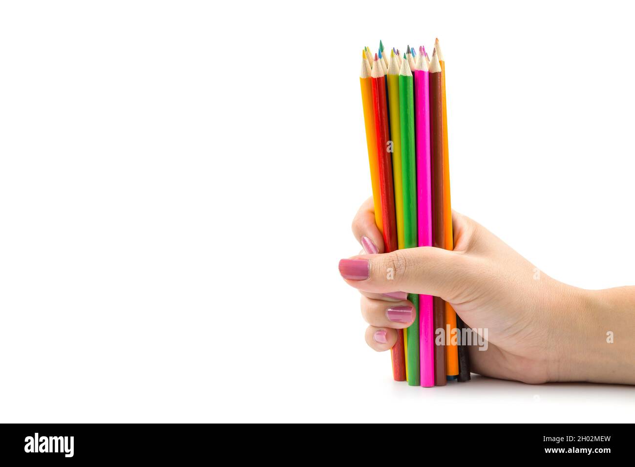 Colored pencils in female hand on white background Stock Photo - Alamy