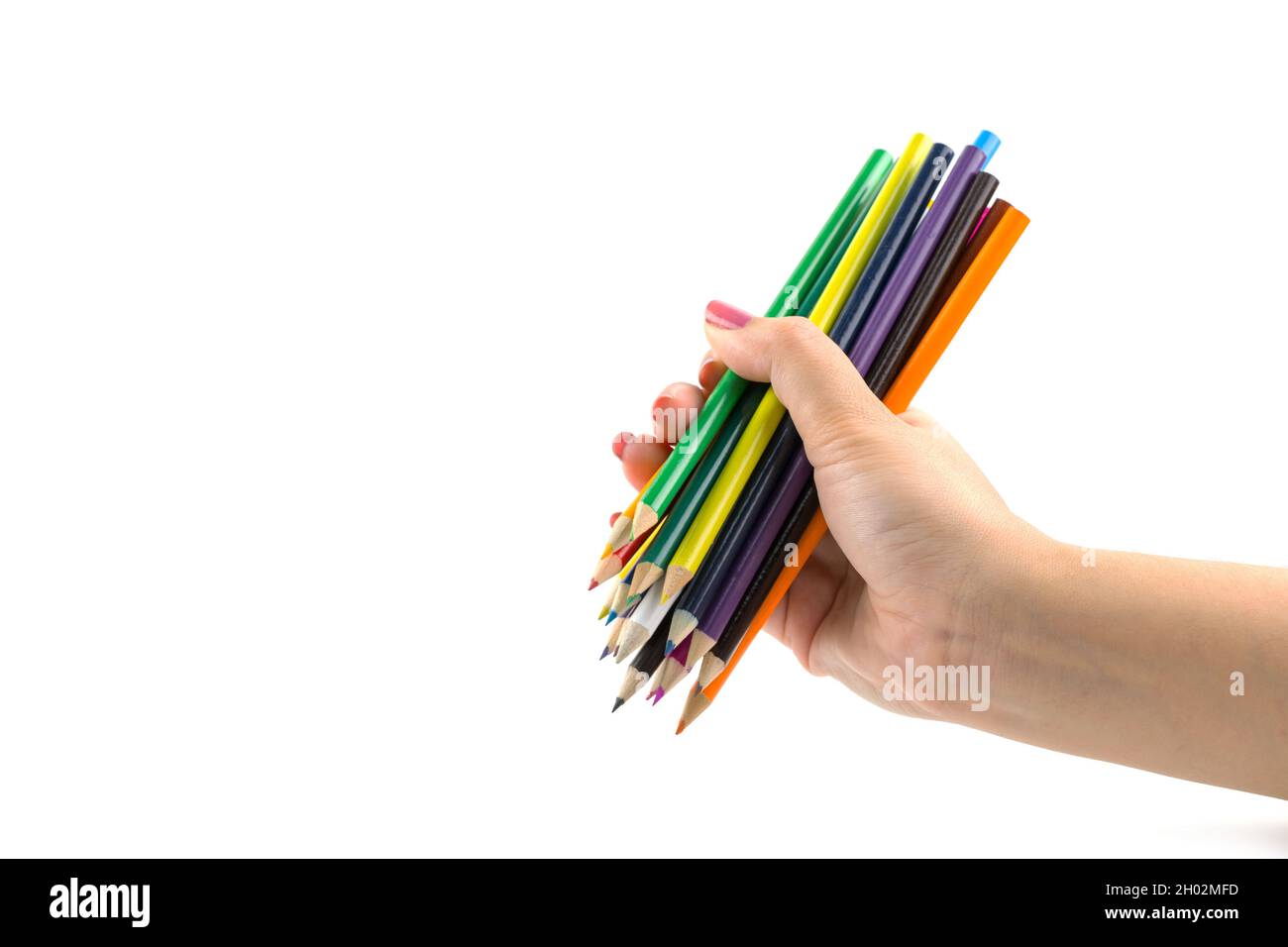 Colored pencils in female hand on white background Stock Photo - Alamy