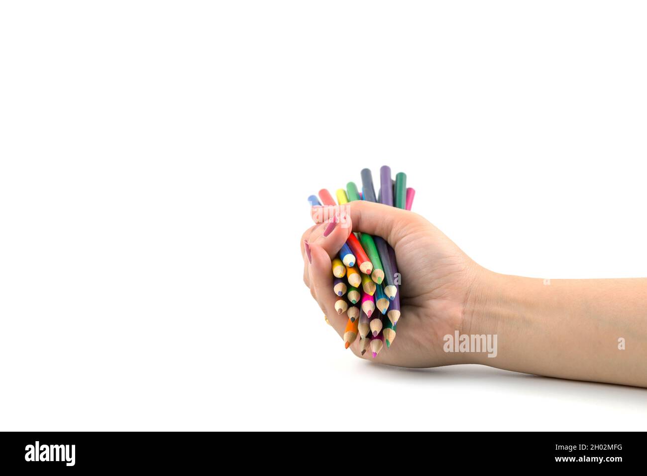 Colored pencils in female hand on white background Stock Photo - Alamy