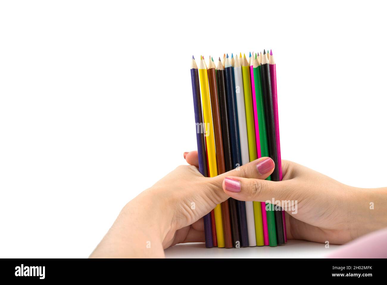 Colored pencils in female hand on white background Stock Photo - Alamy