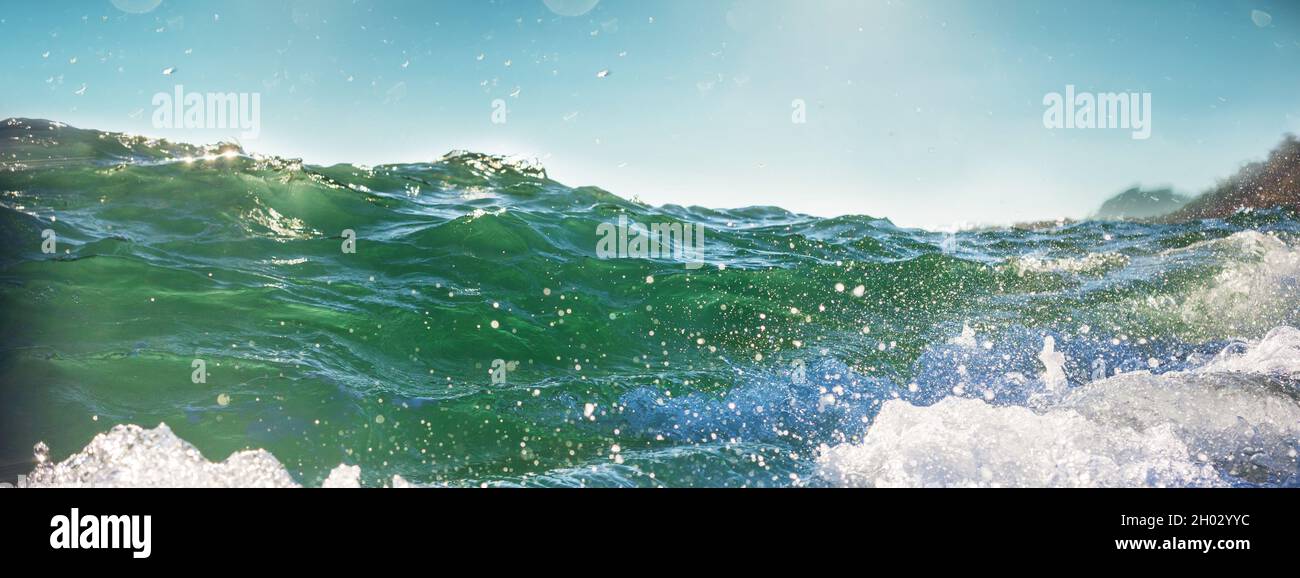 Blue wave on the beach. Dramatic natural background Stock Photo - Alamy