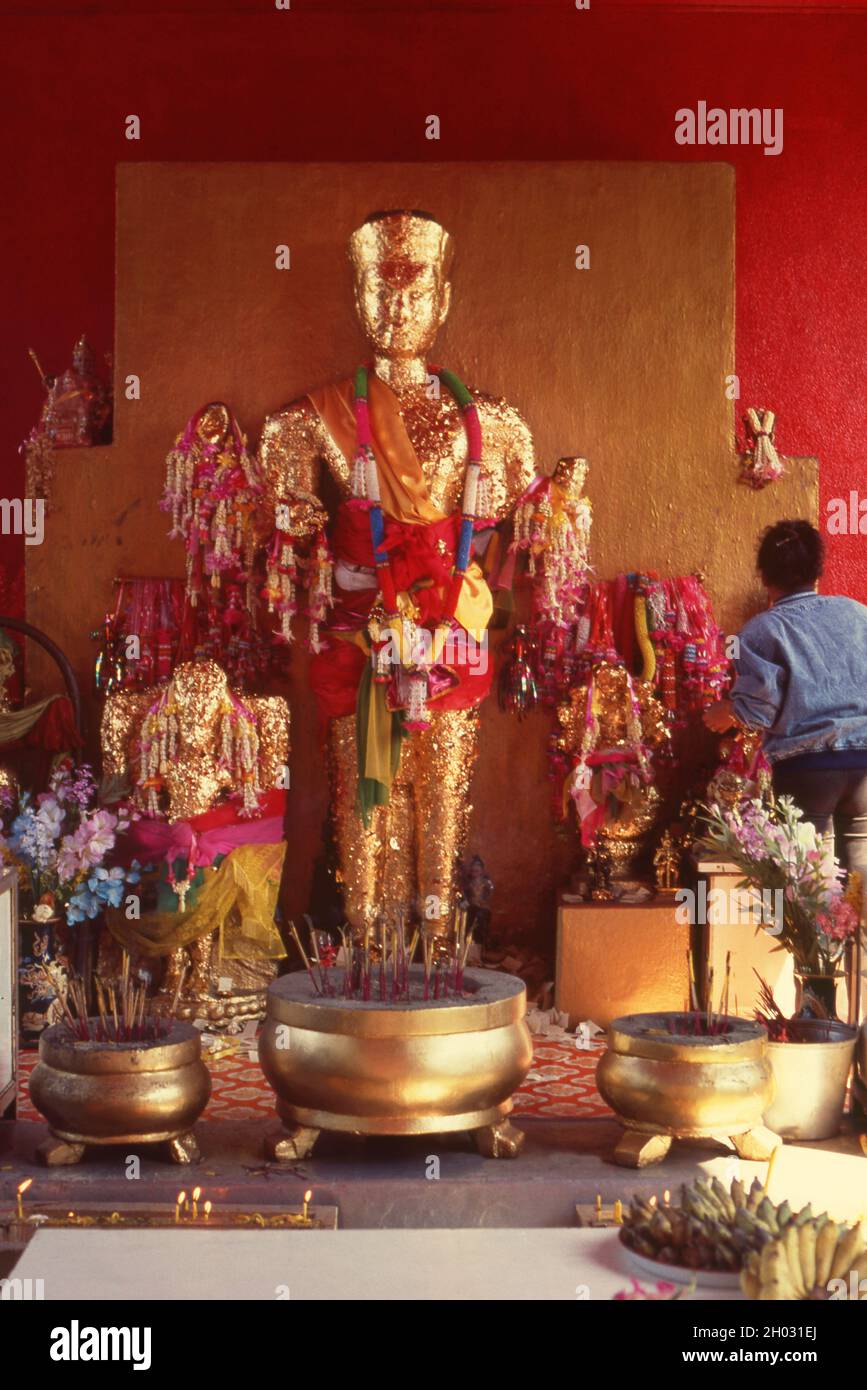 Thailand: A four-armed Vishnu statue with a later addition Buddha head ...