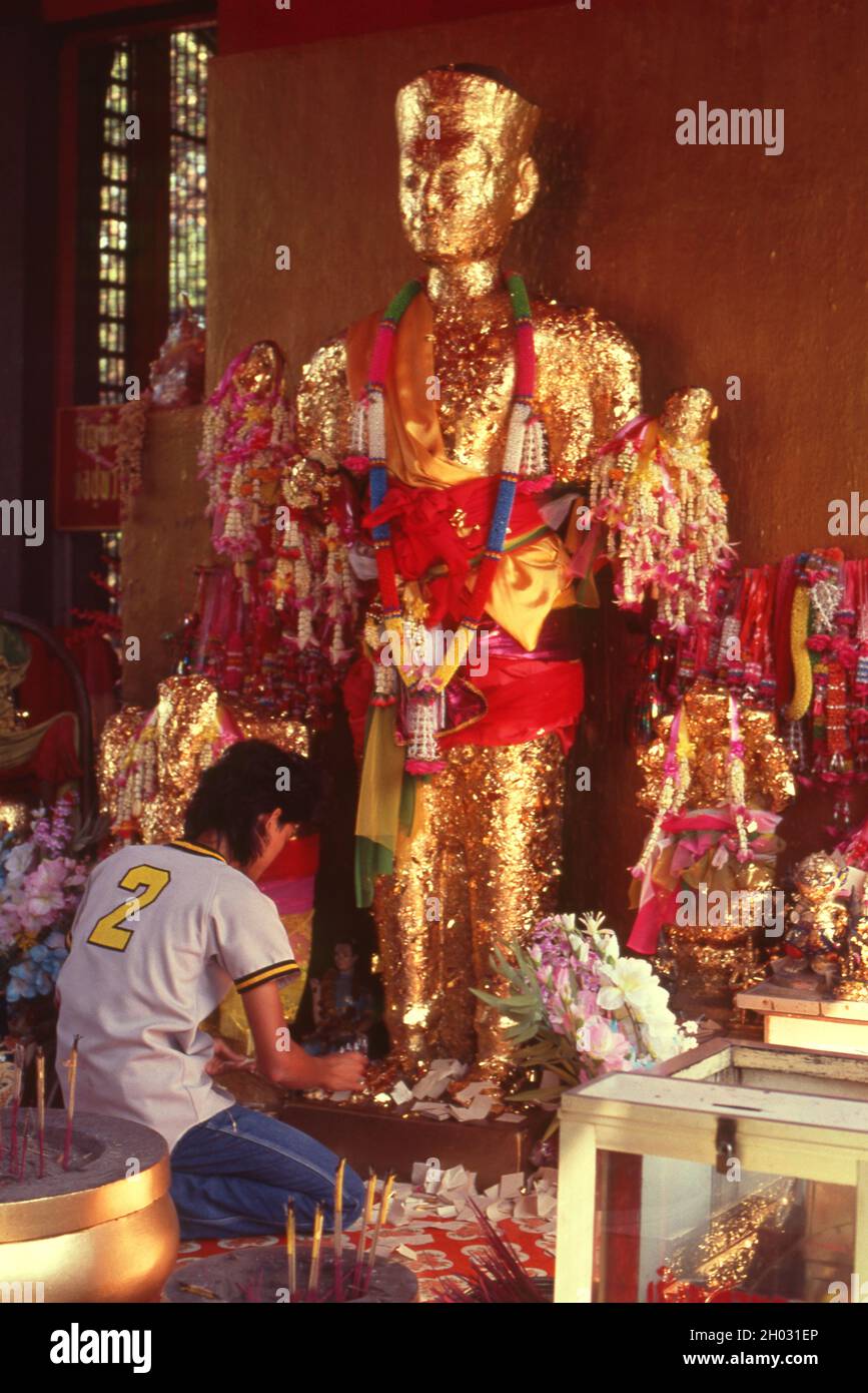 Thailand: A four-armed Vishnu statue with a later addition Buddha head ...