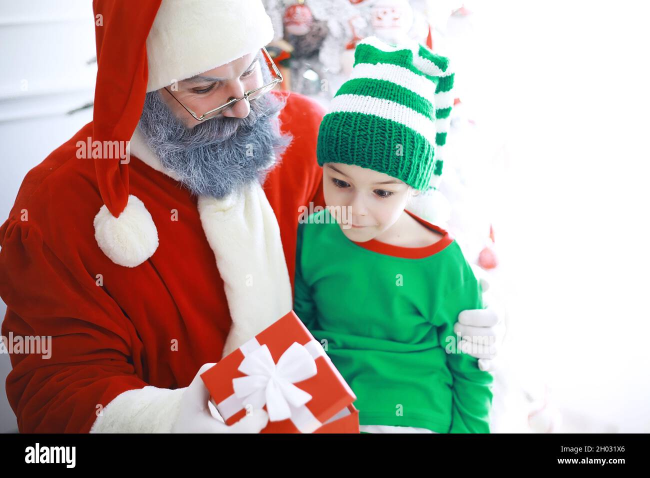 Santa Claus's helpers.Cute children in christmas elf costumes in a room ...