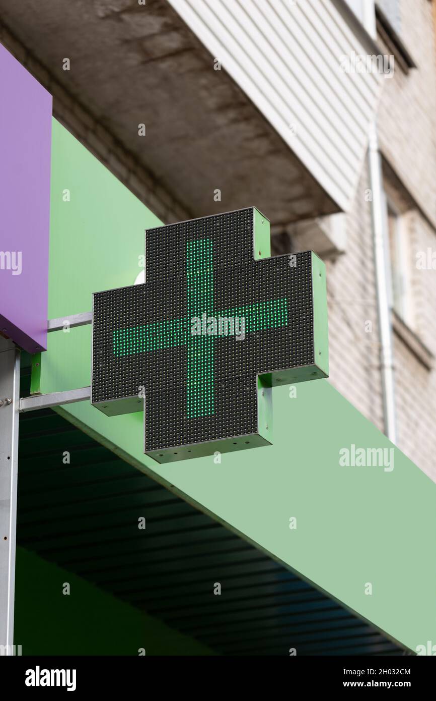 Close up of medical cross on pharmacy building, pharmacy and ...