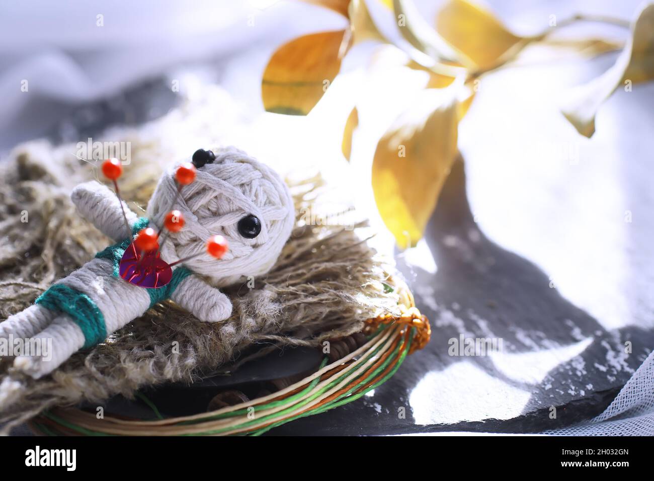 Voodoo Doll on a stone background with dramatic lighting. Mystic still ...