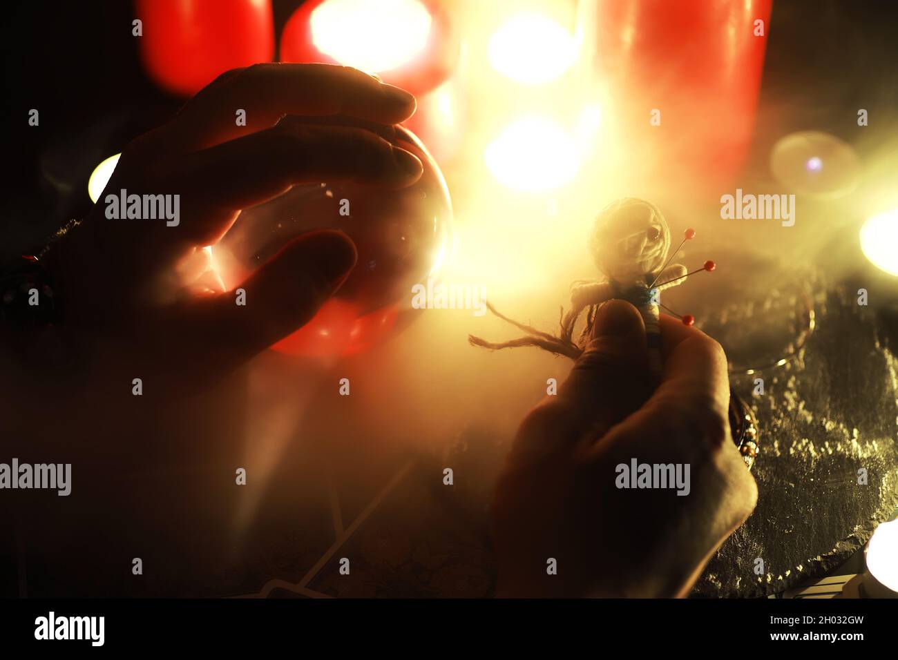 Mystic still life with voodoo doll, the tarot cards, books, evil ...