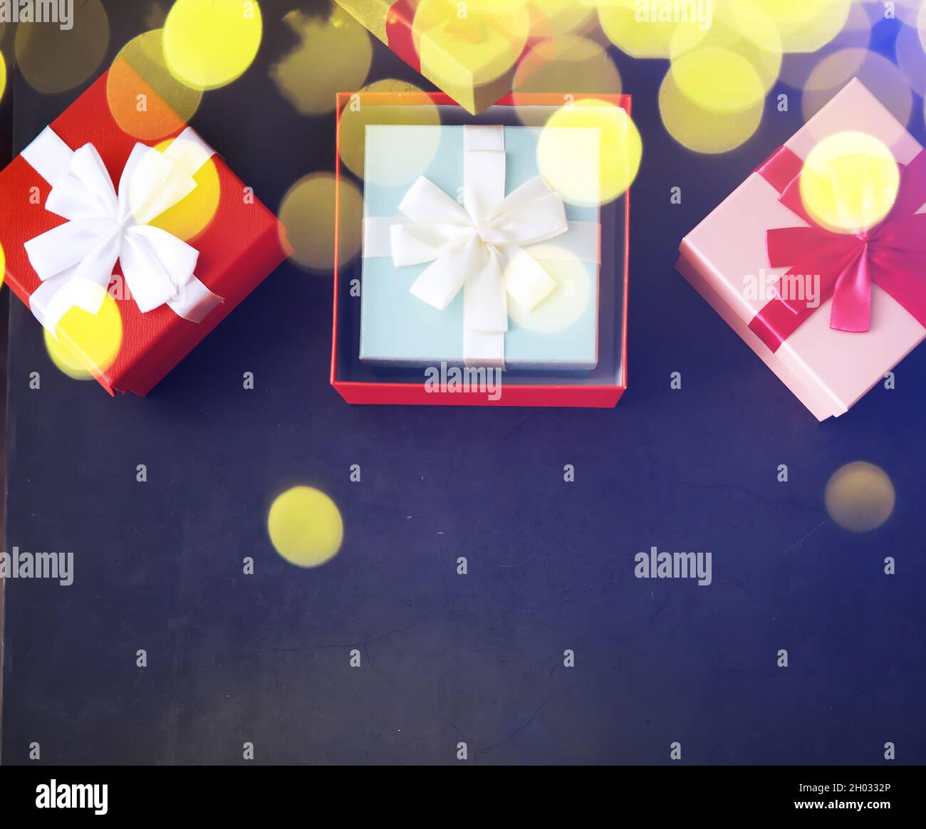 Christmas decoration. Gift boxes on black stone background. Top view ...