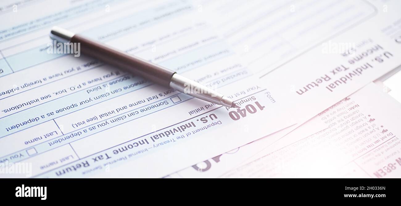 Annual tax reporting. Tax form on the table. Financial statements ...