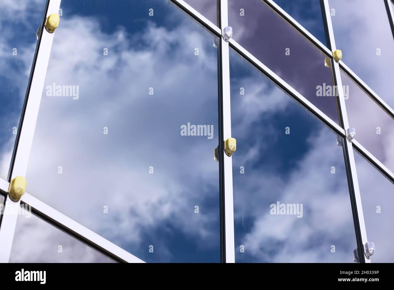 Architectural detail of the facade with multiple reflections of other ...