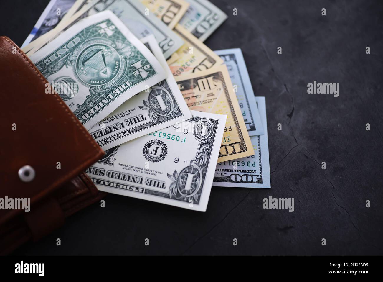 Cash money in a large pile as a finance background. Paper money close ...