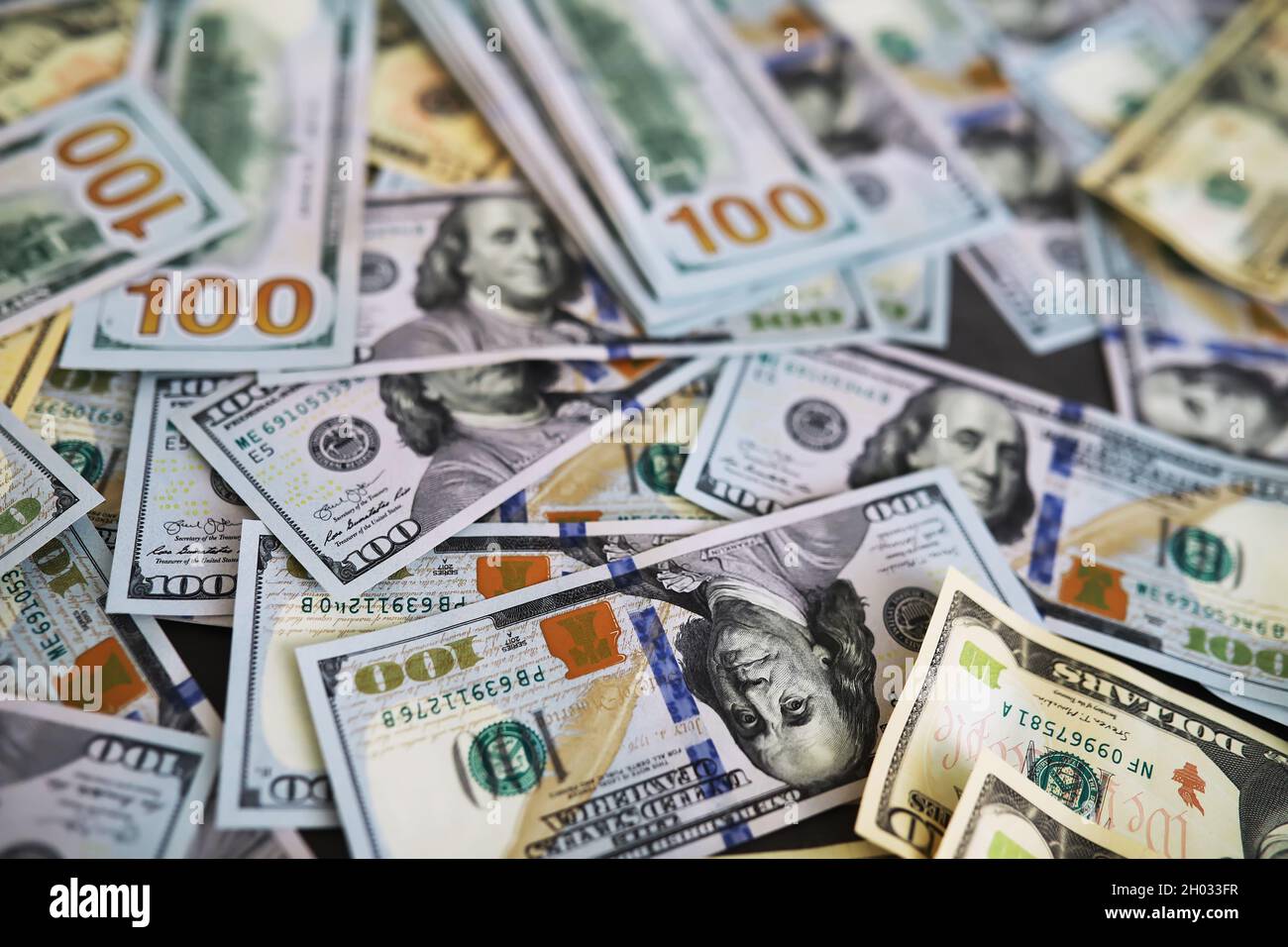 Cash money in a large pile as a finance background. Paper money close ...